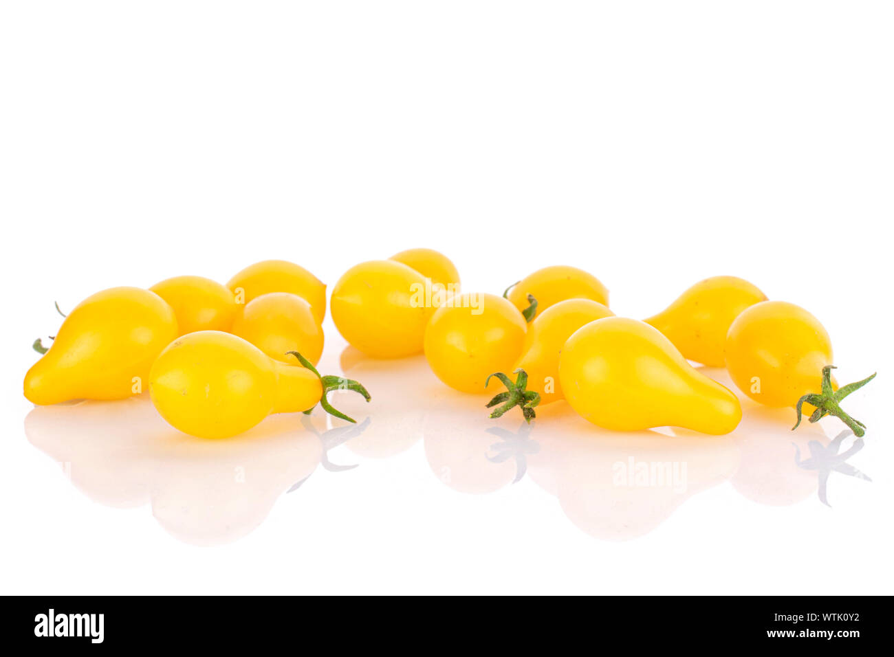 Lot of whole fresh yellow pear tomato isolated on white background ...