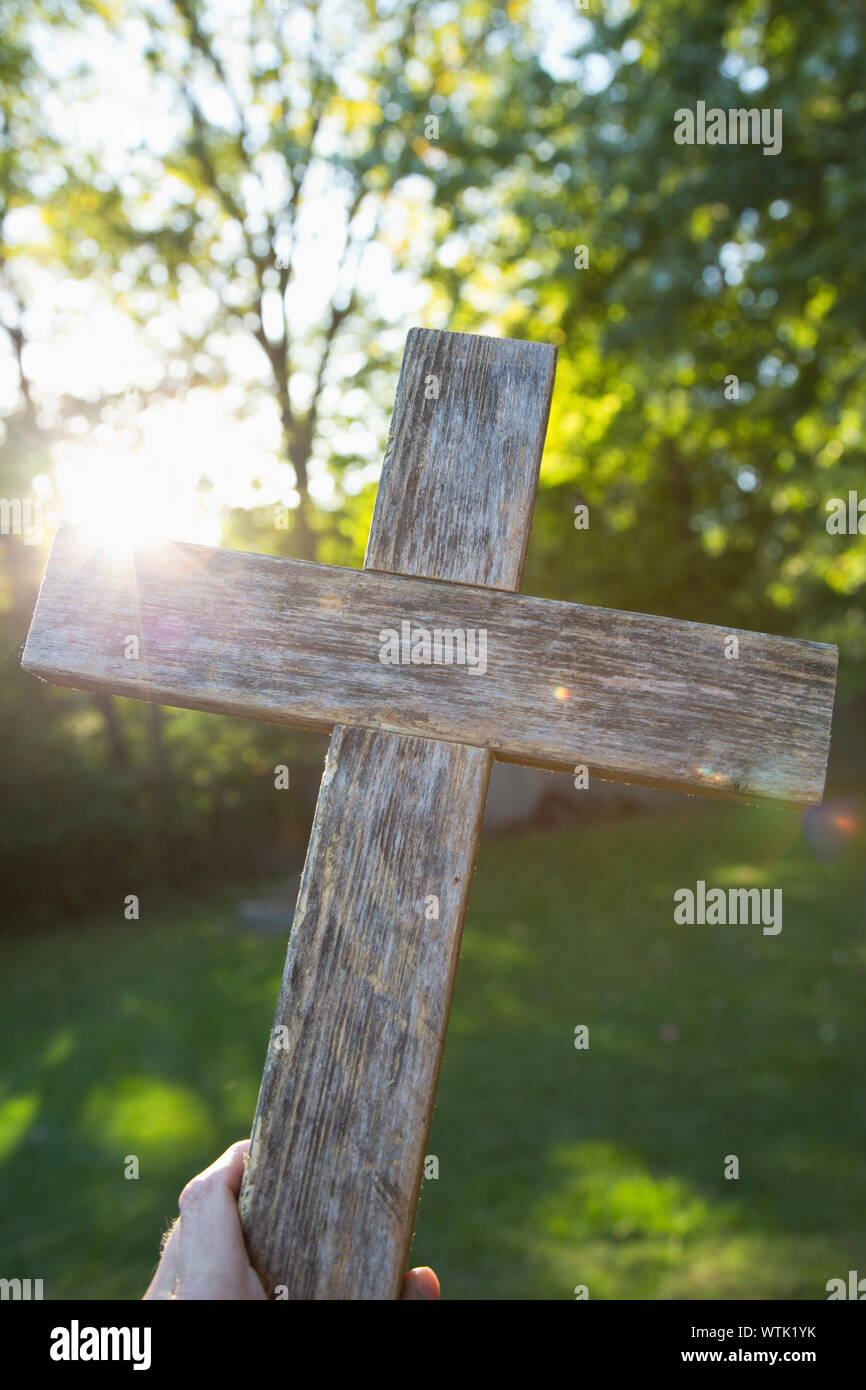 Holding Wooden Cross High Resolution Stock Photography and Images - Alamy