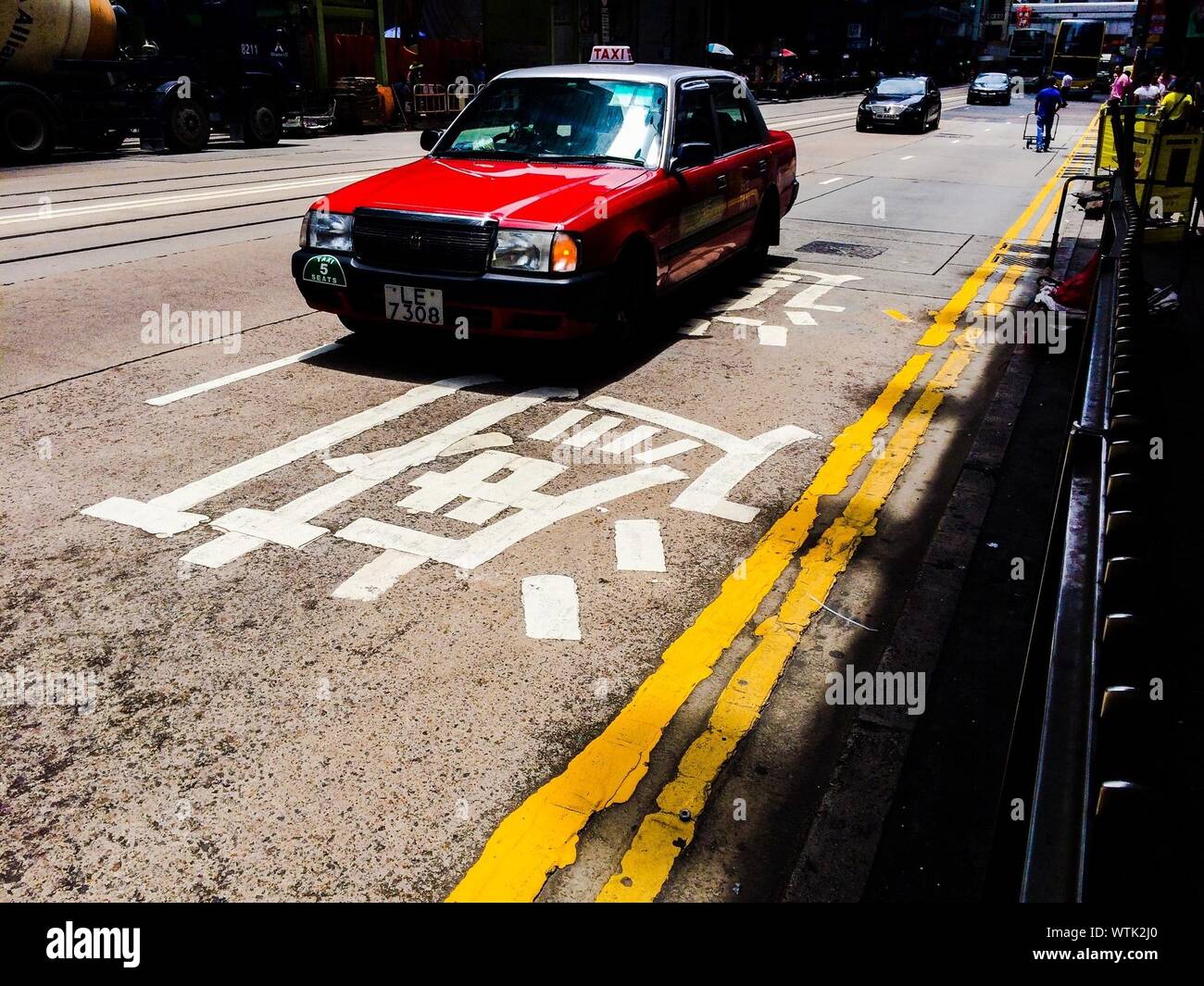 Red and white taxi hi-res stock photography and images - Alamy