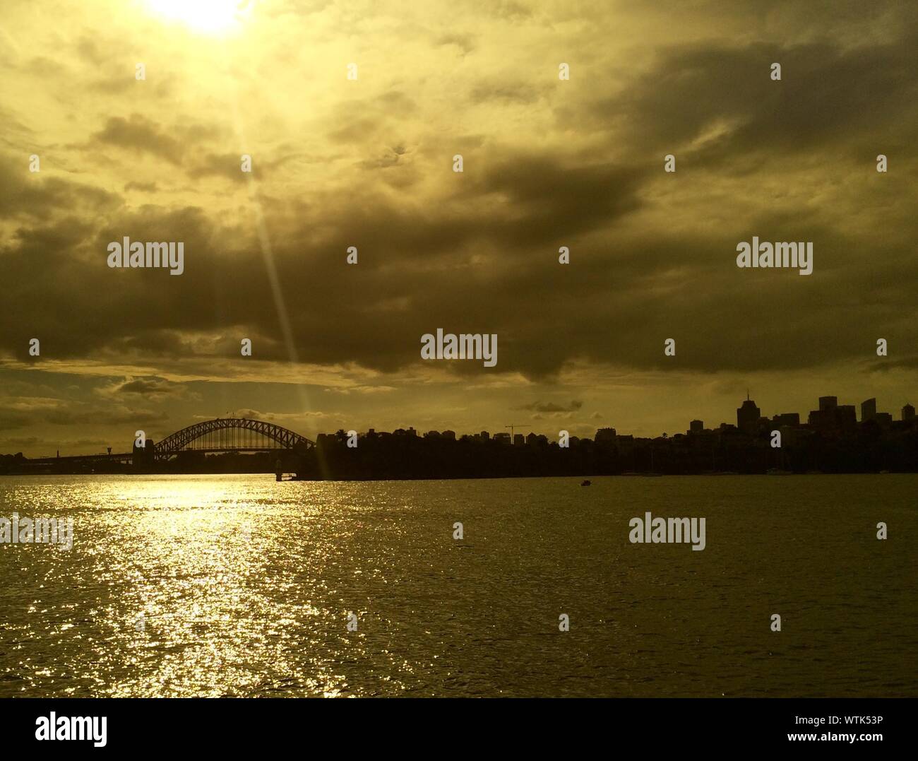 Yellow Toned Image Of River And Sunbeam Coming Through Clouds Stock ...