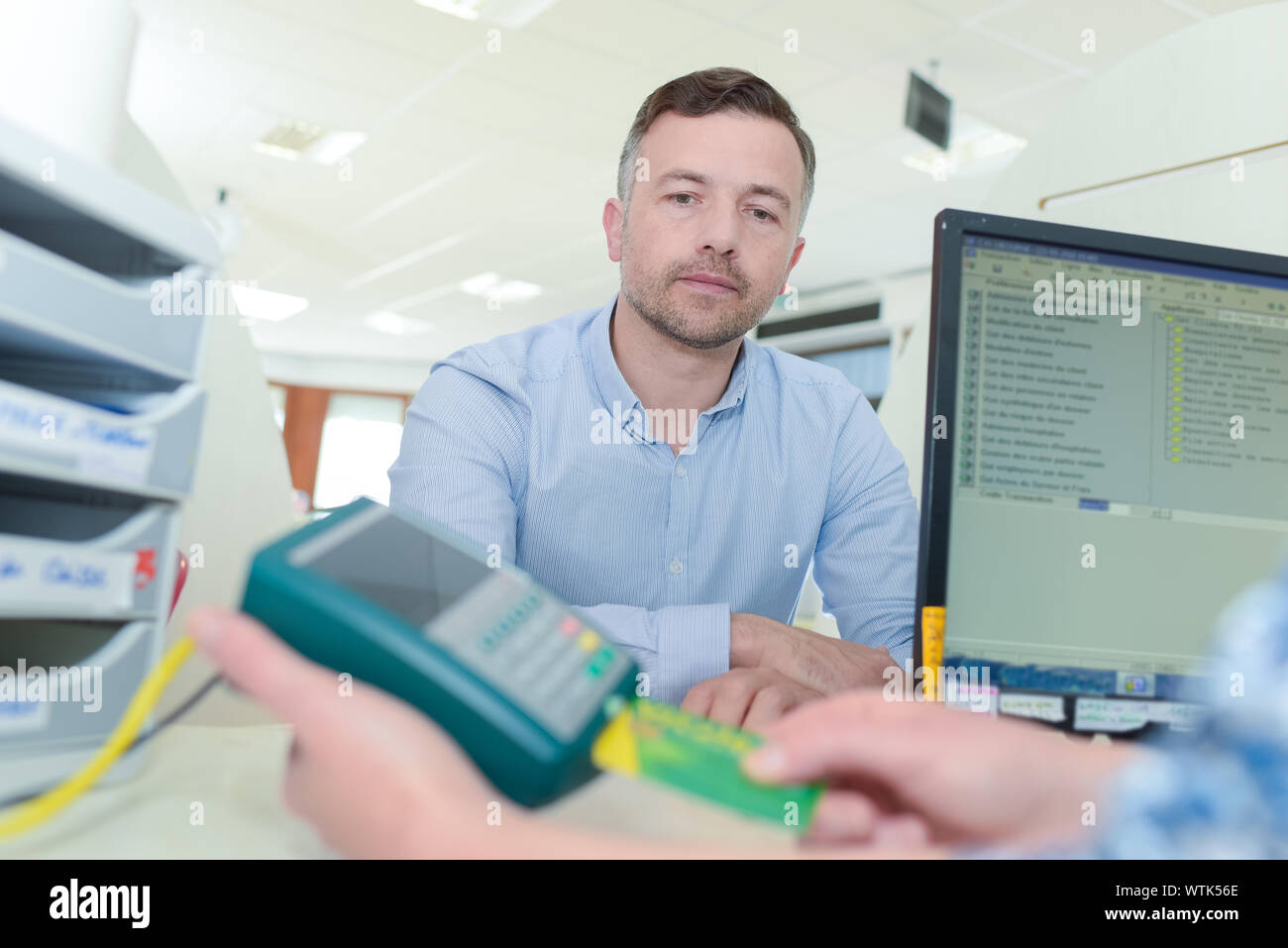 man giving a card to a doctor Stock Photo - Alamy