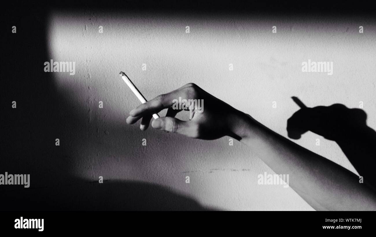 Cigarette in hand hi-res stock photography and images - Alamy