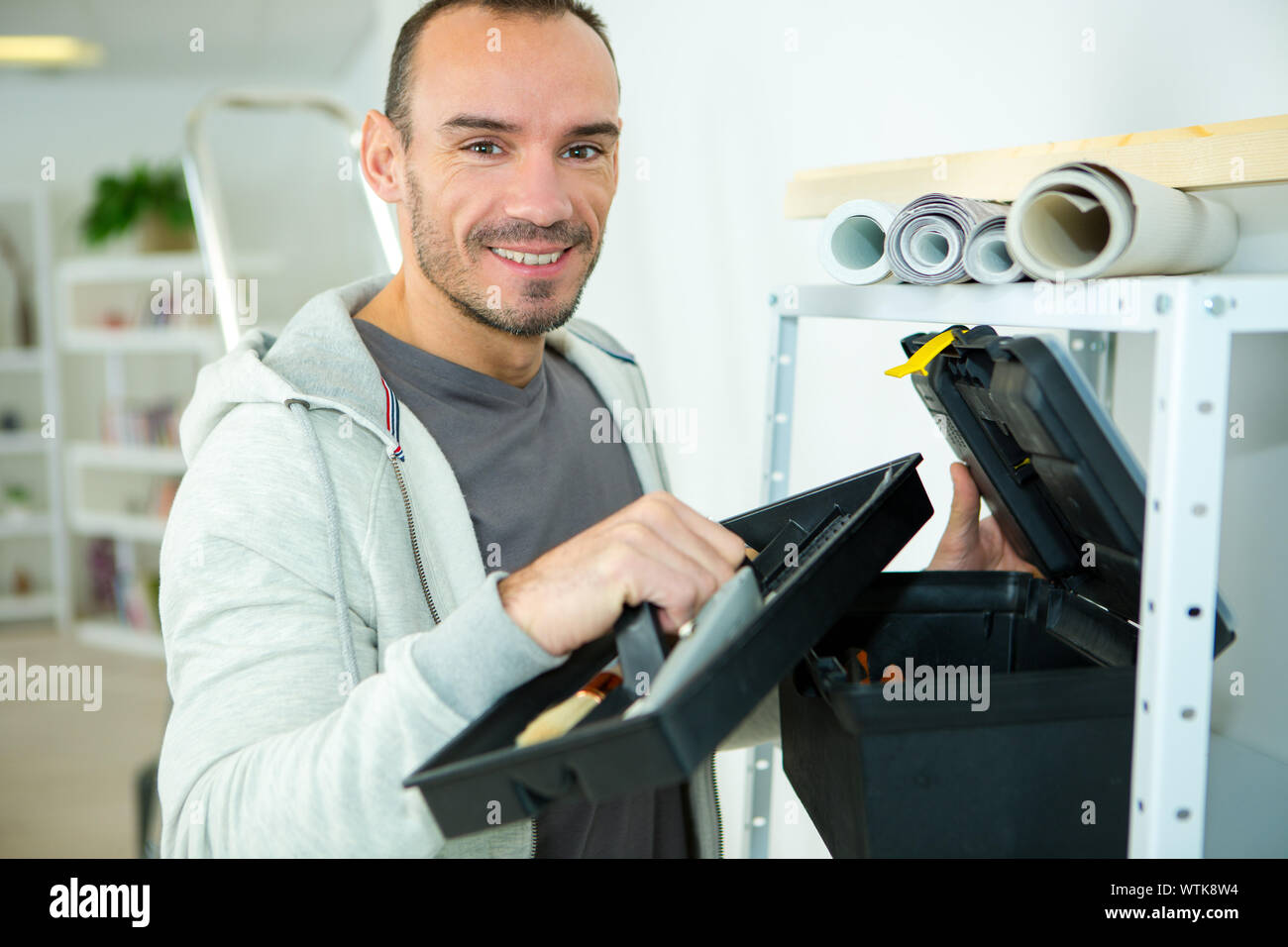 smiling handyman with his toolbox Stock Photo - Alamy