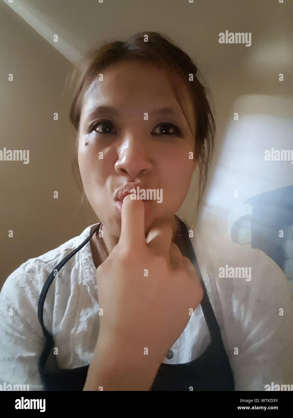Woman finger mouth hi-res stock photography and images - Alamy
