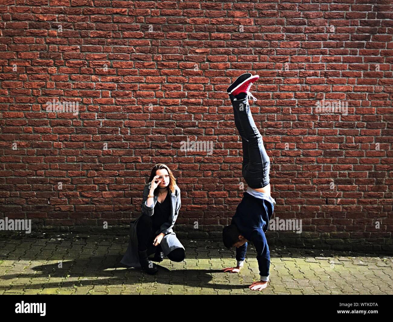 Brick handstand hi-res stock photography and images - Alamy