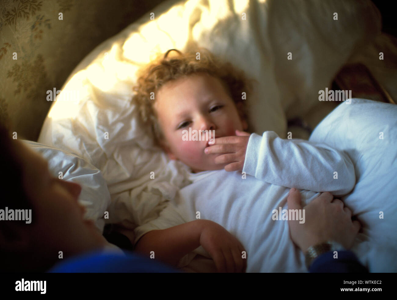 Tired little boy at bedtime Stock Photo - Alamy