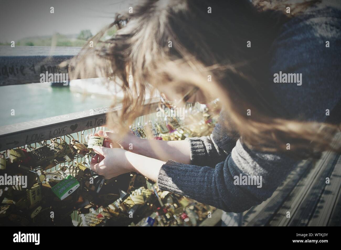 Man locking love lock hi-res stock photography and images - Alamy