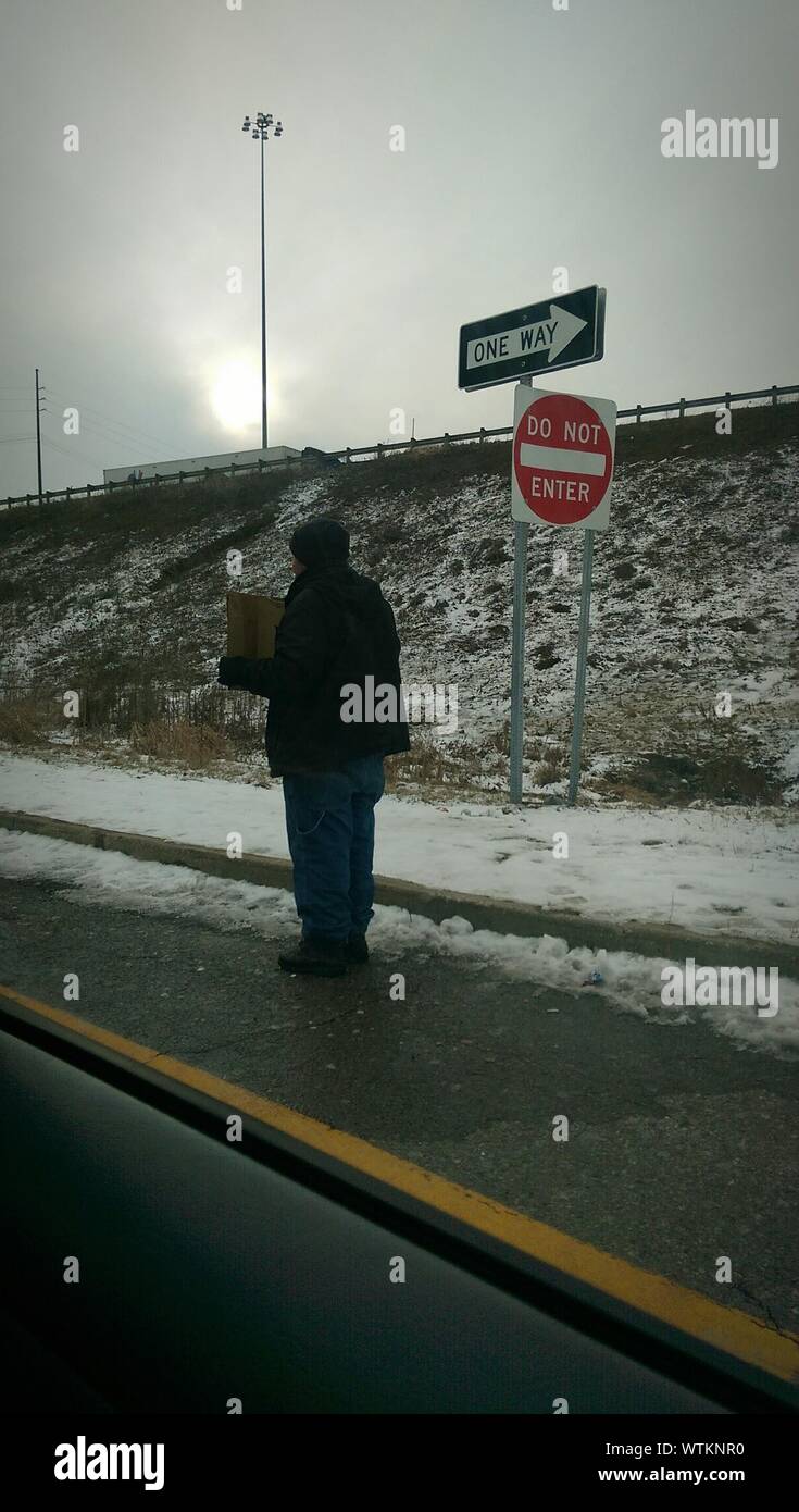 Homeless man and sign hi-res stock photography and images - Alamy