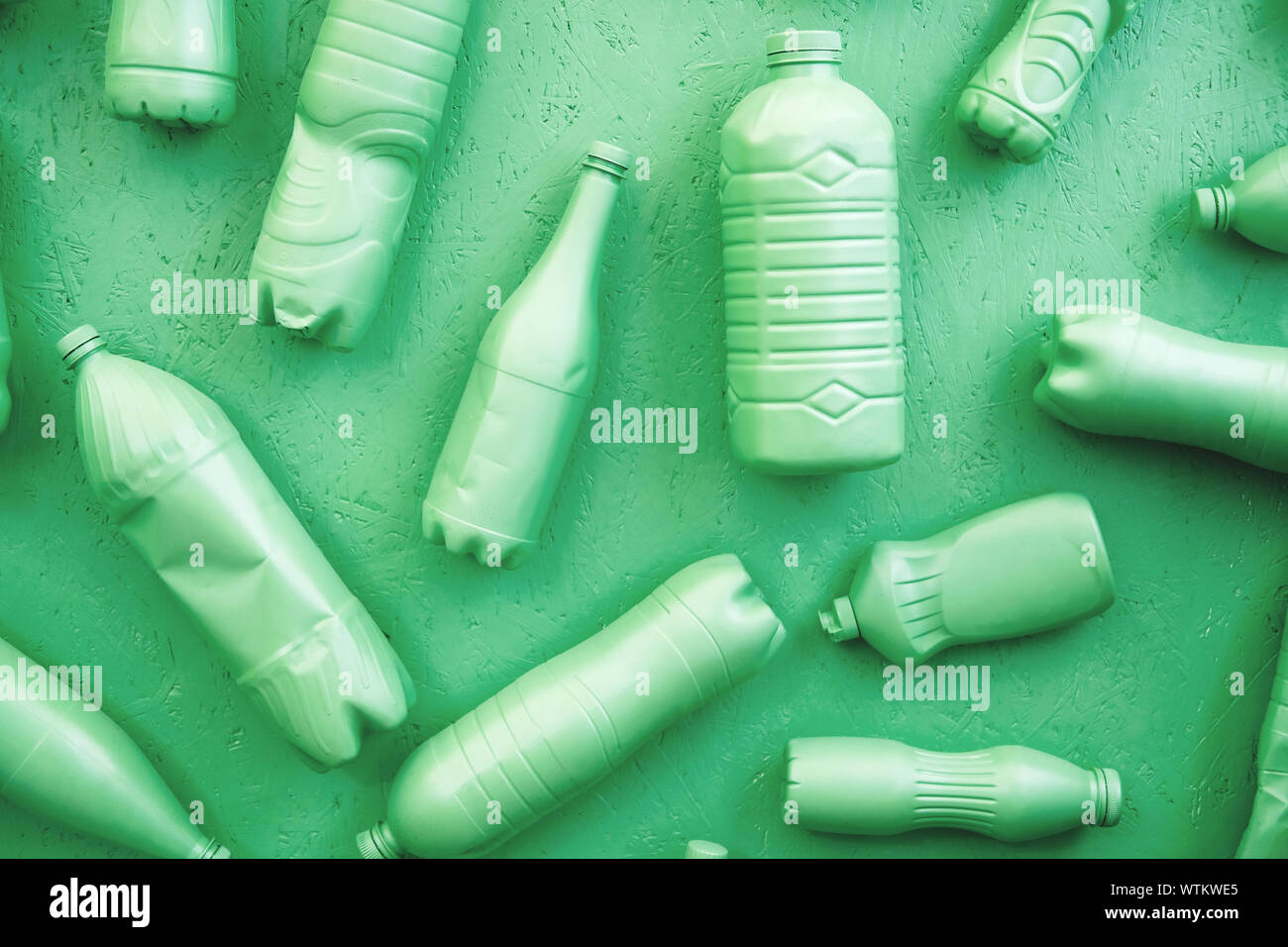 Plastic bottles in mint color. Eco concept. All bottles are in one ...