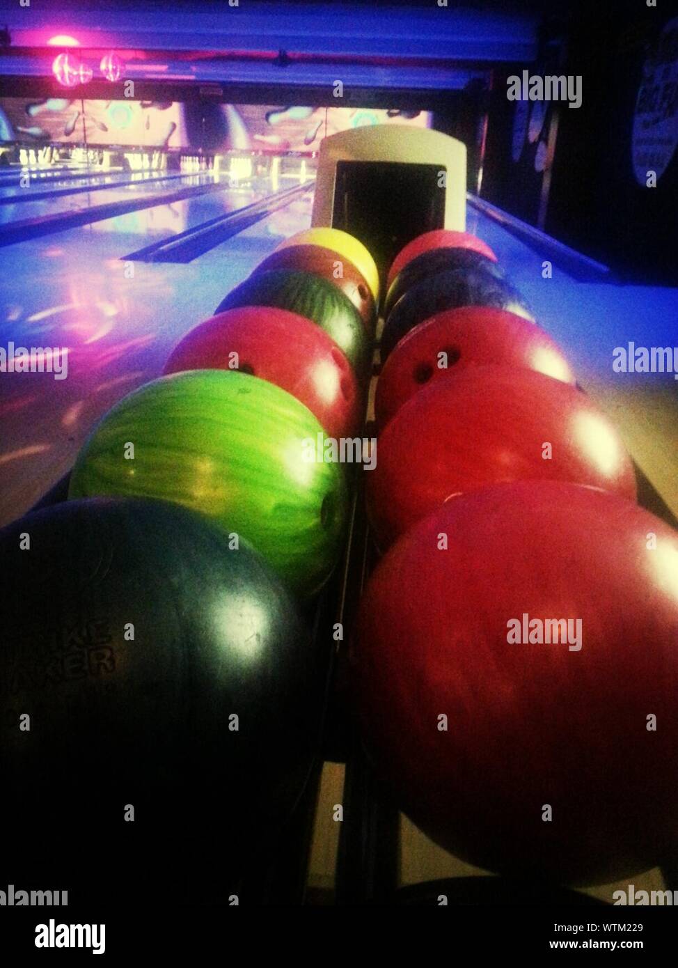 Bowling balls in rack hi-res stock photography and images - Alamy