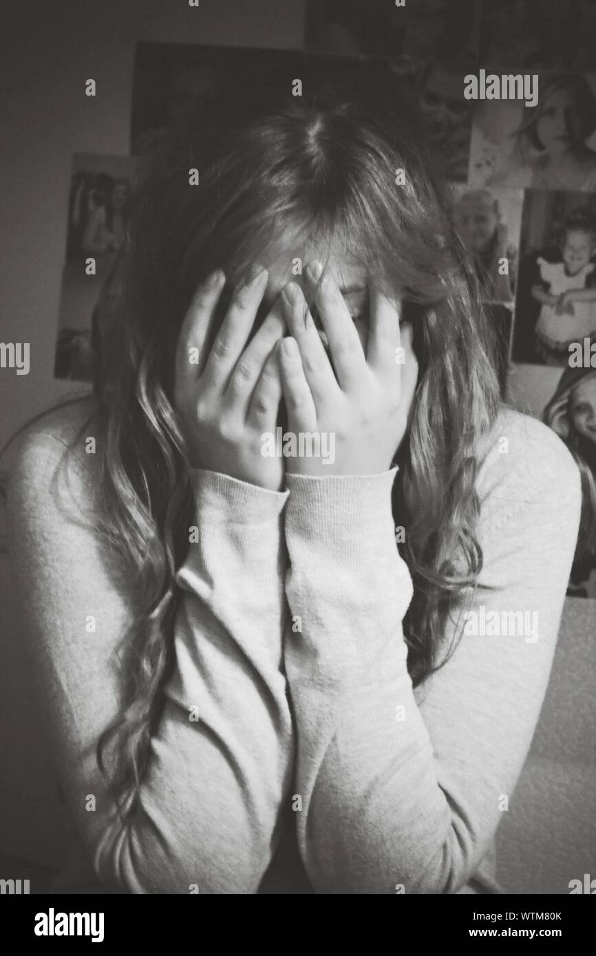 Face covered with hands hi-res stock photography and images - Alamy