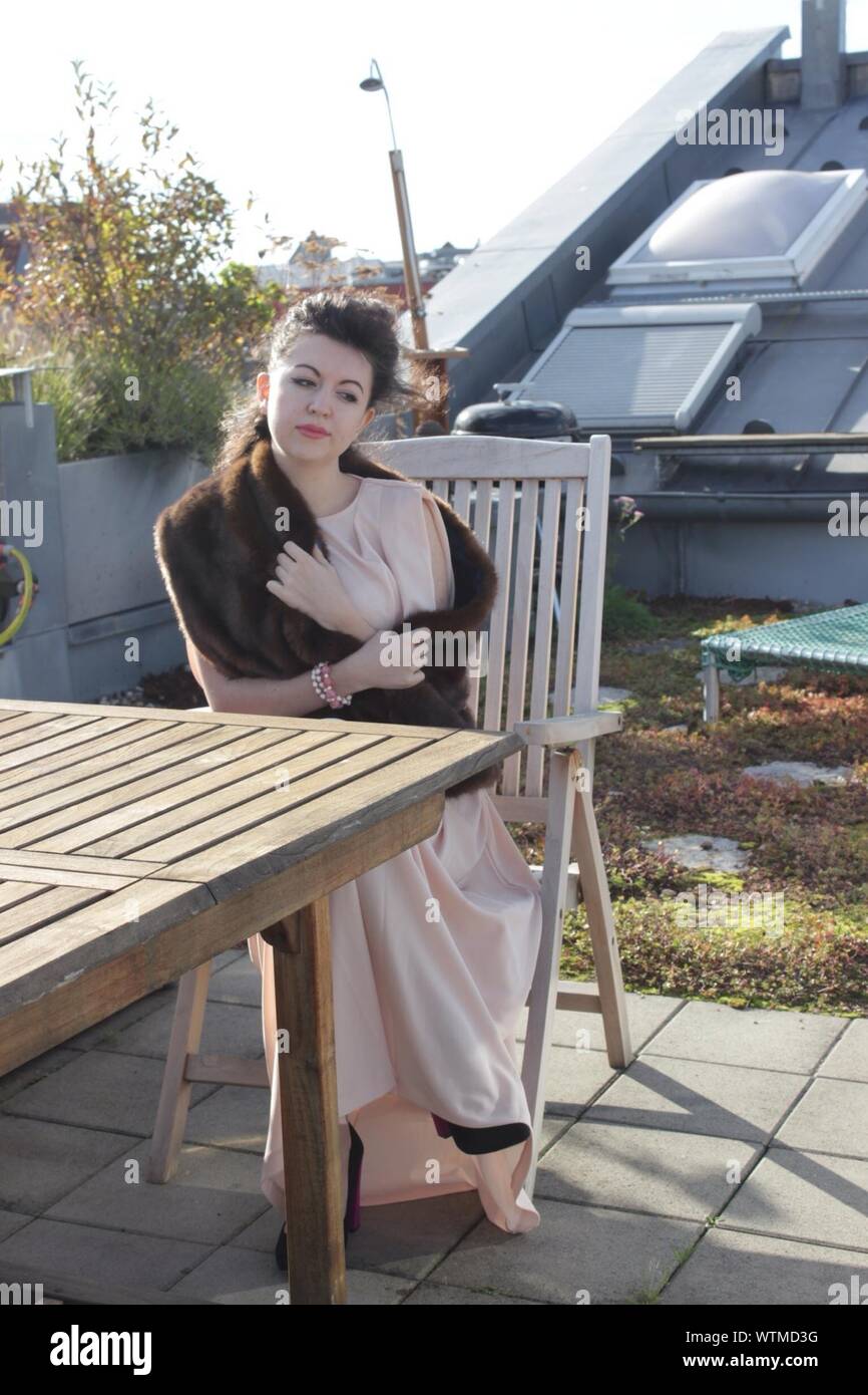 Model sitting on chair hi-res stock photography and images - Alamy