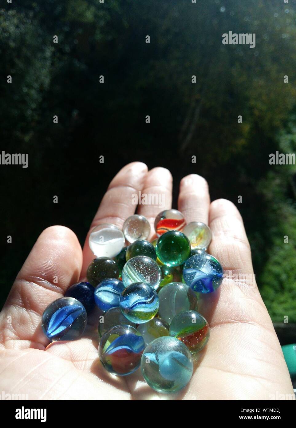 Holding marbles hi-res stock photography and images - Alamy
