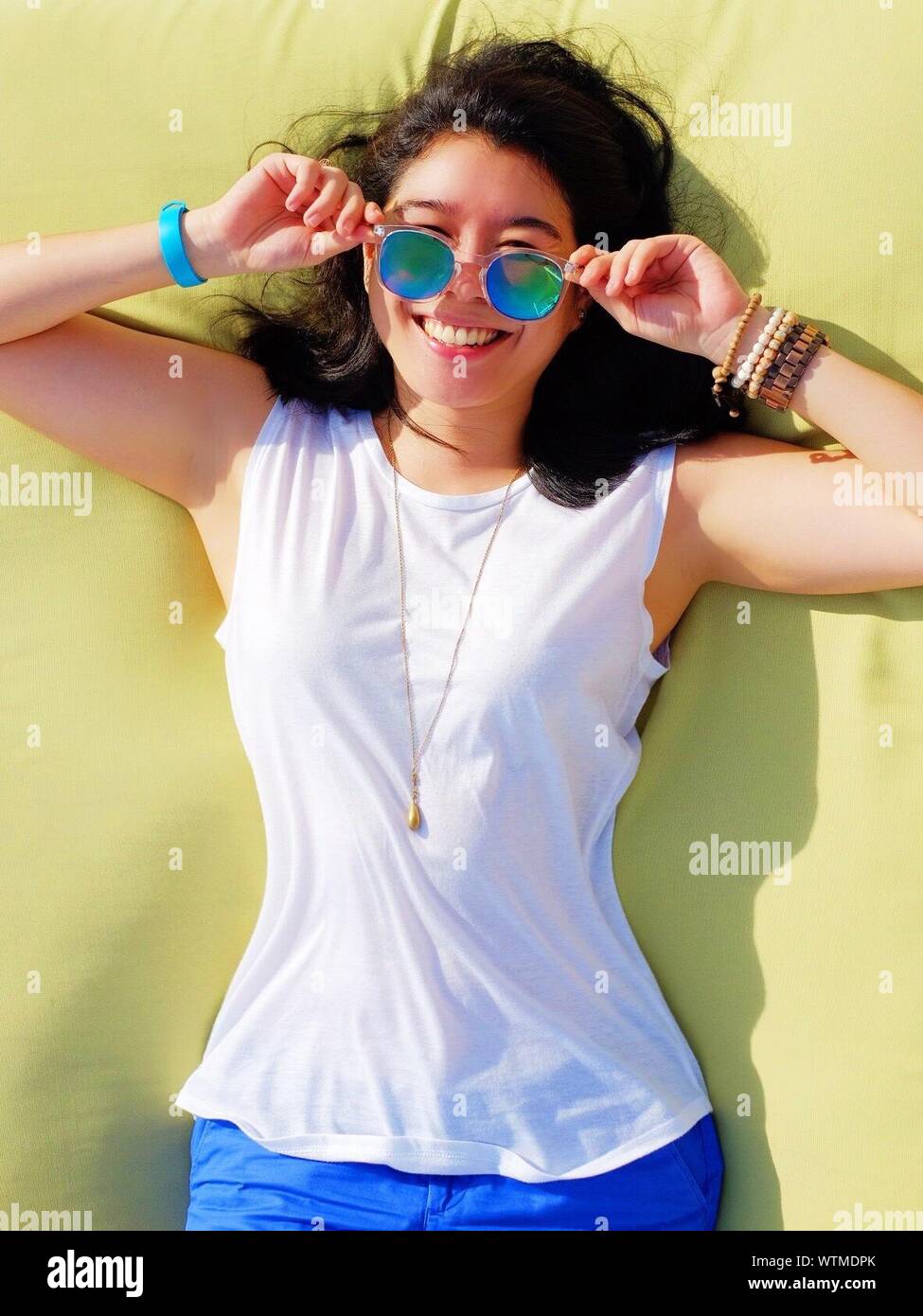 Woman taking off sunglasses hi-res stock photography and images - Alamy