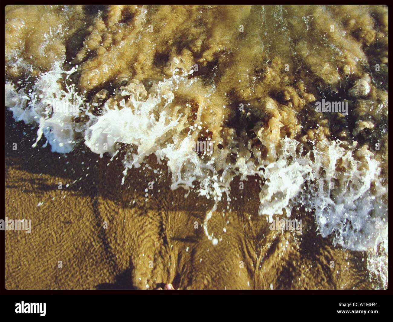 Water washing up on beach hi-res stock photography and images - Alamy