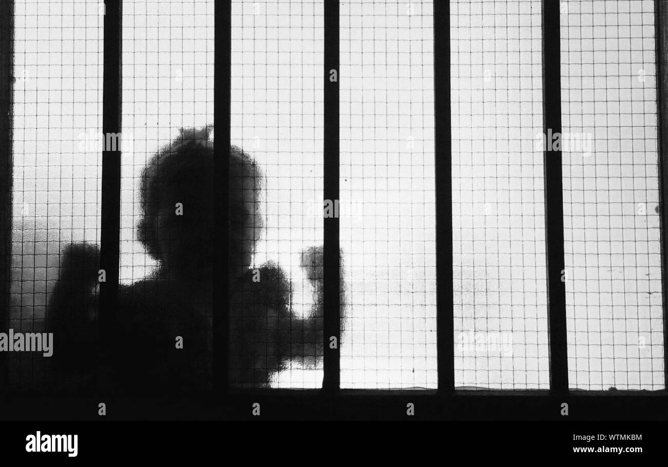 People behind the window Black and White Stock Photos & Images - Alamy