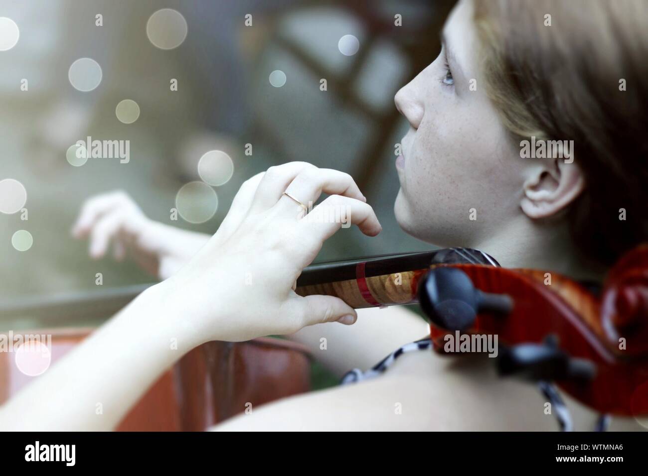 Girls playing instrument hi-res stock photography and images - Alamy