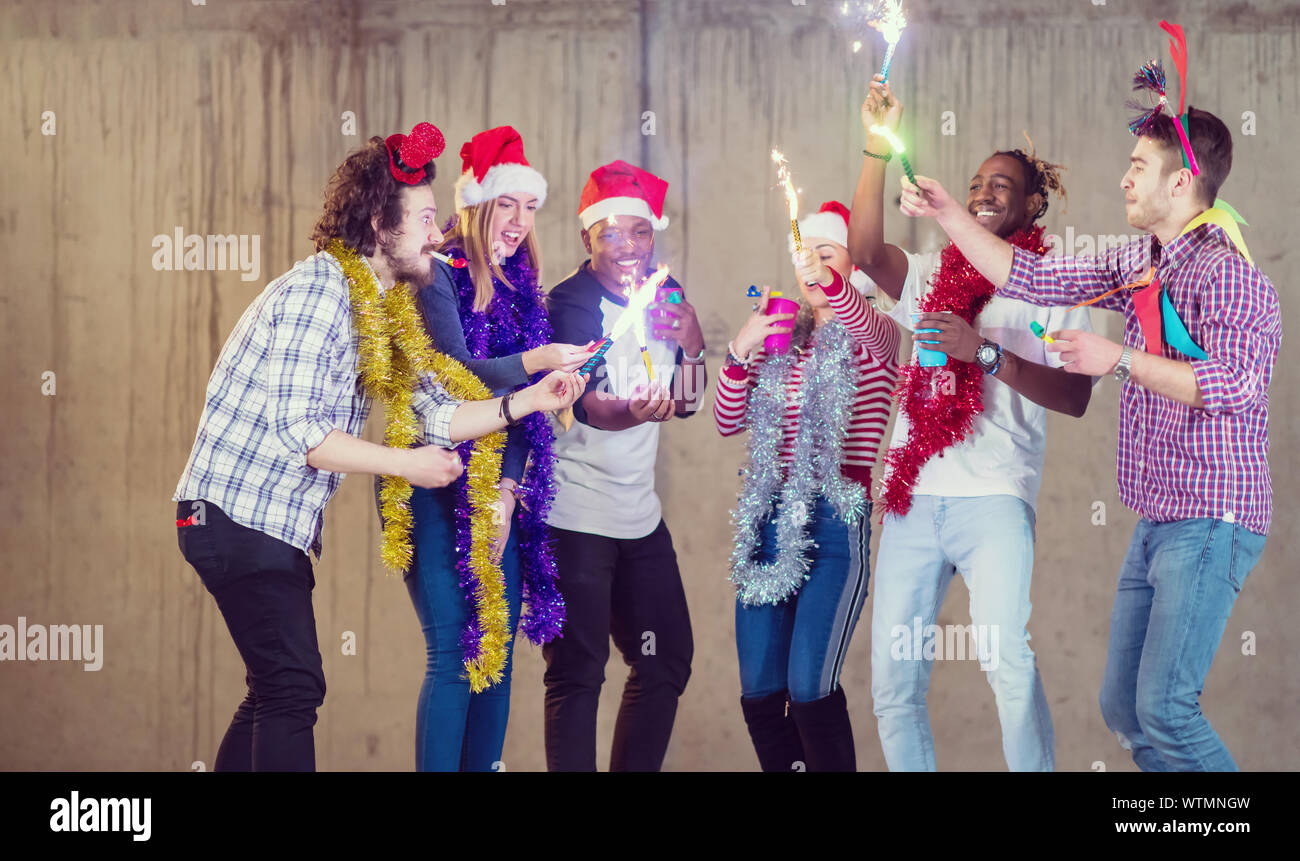 multiethnic group of young happy casual business people dancing with ...