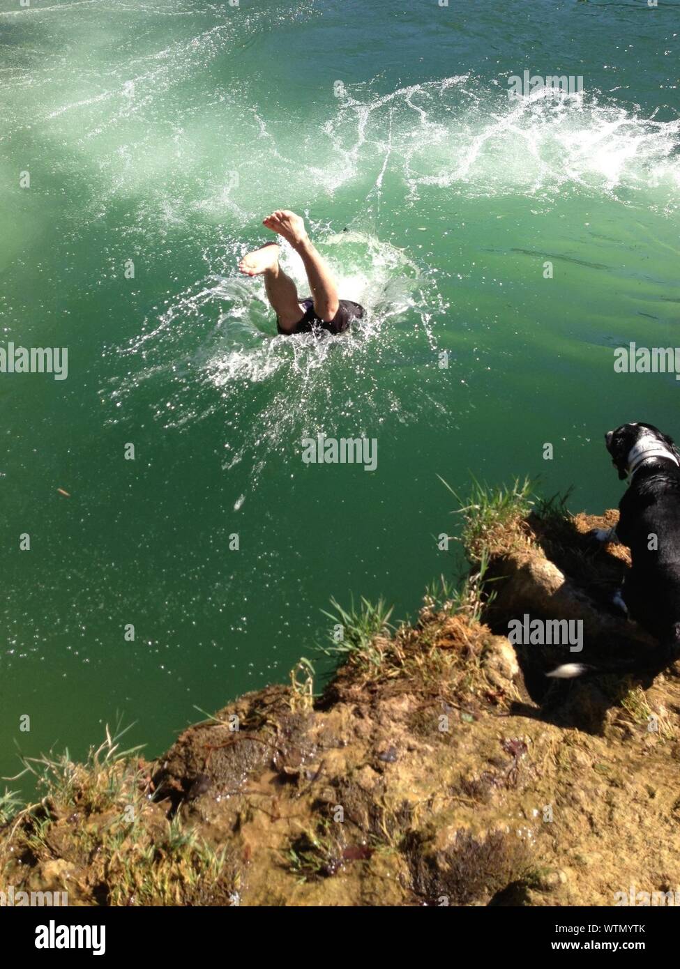 Man jumping water hi-res stock photography and images - Alamy
