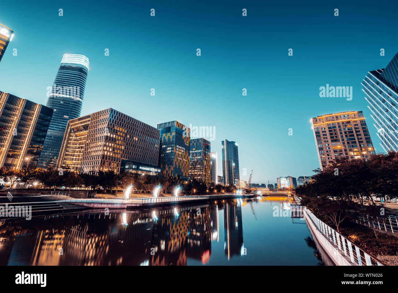 Modern city skyline, Ninbo, China at night Stock Photo - Alamy