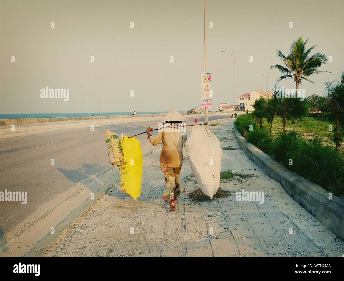 Woman carrying sack hi-res stock photography and images - Alamy