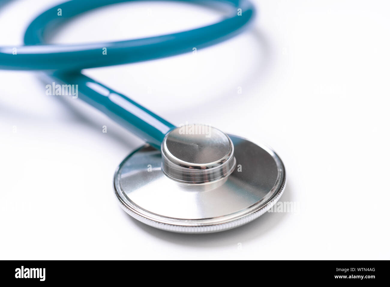 Green stethoscope, object of doctor equipment for heartbeat trace ...