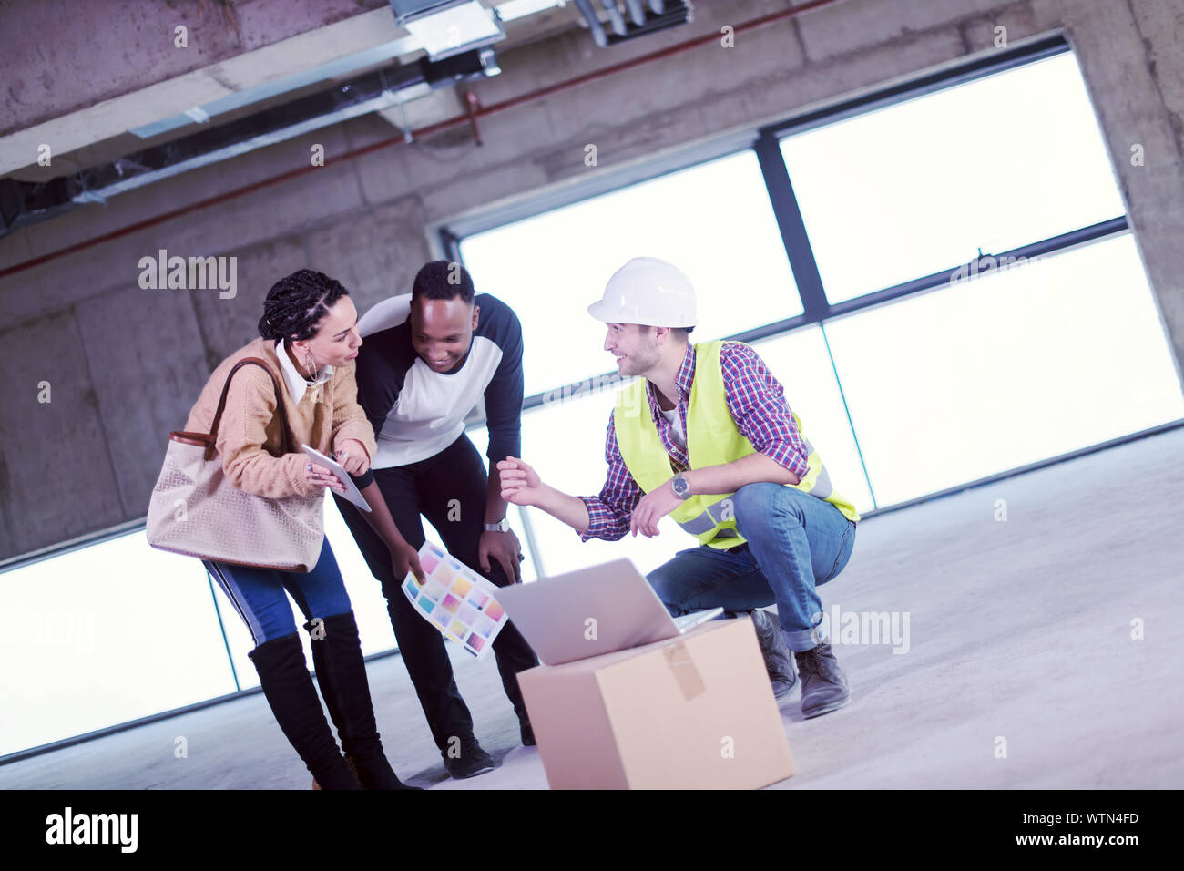 architect engineer using laptop computer while showing house design ...