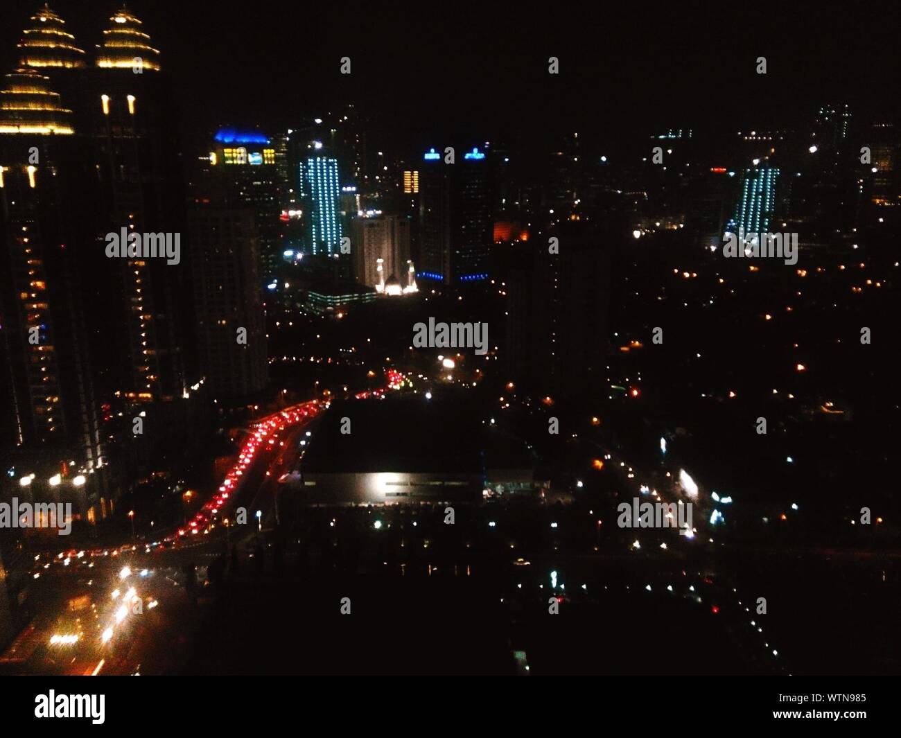 Aerial view of buildings illuminated at night hi-res stock photography ...