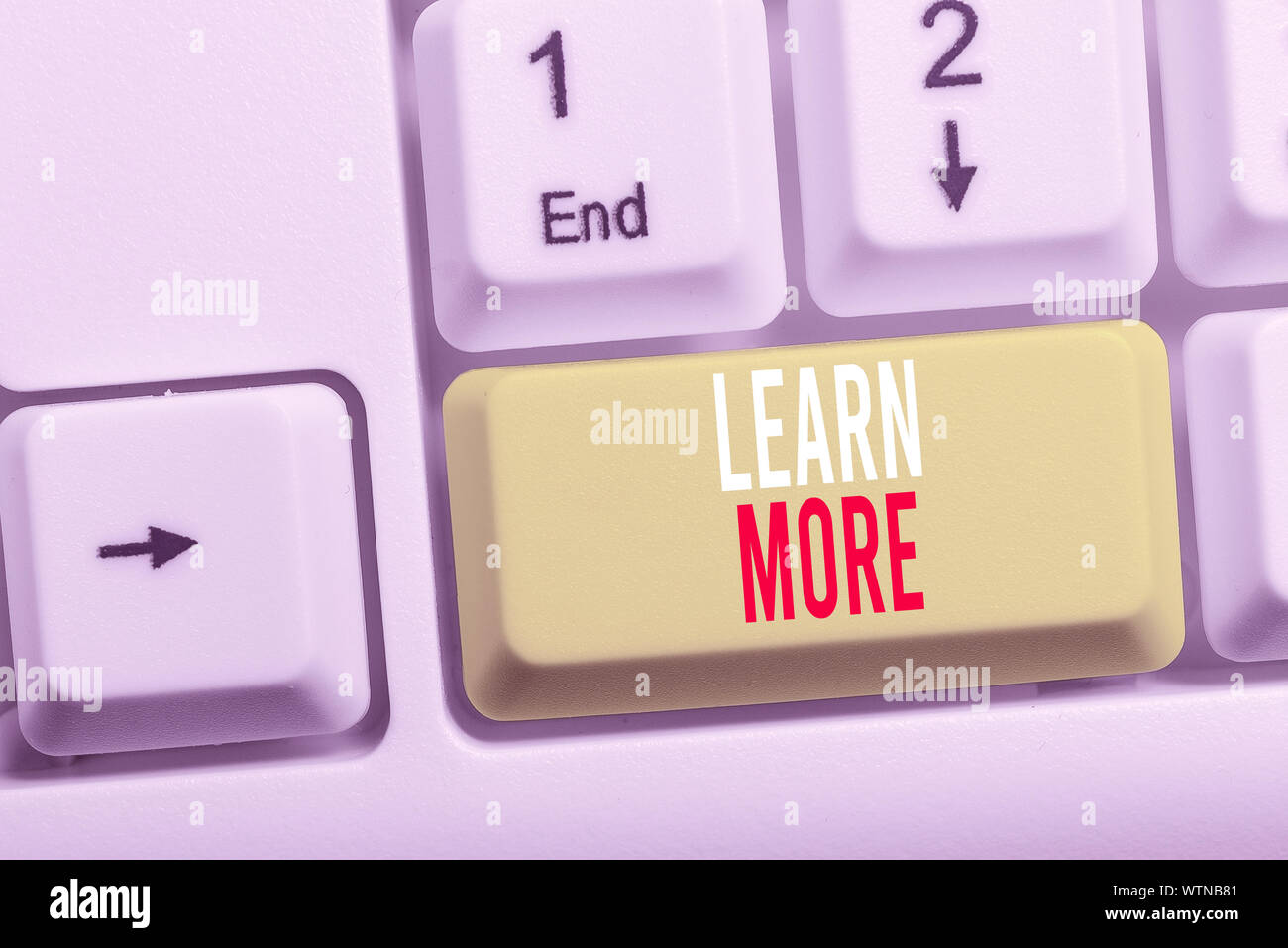 Writing note showing Learn More. Business concept for knowledge or ...