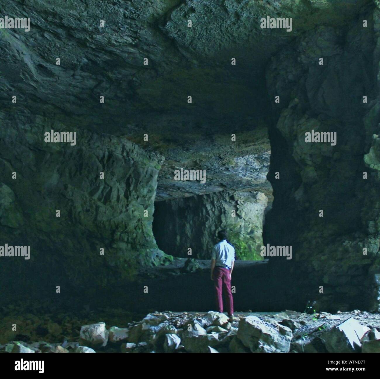 Man standing in cave hi-res stock photography and images - Alamy
