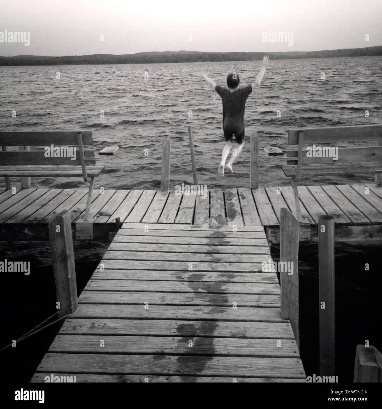 Boy Jumping In Water Rear View High Resolution Stock Photography and ...