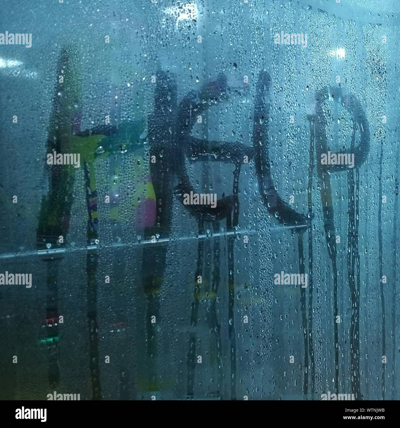 Hand on glass rain hi-res stock photography and images - Alamy