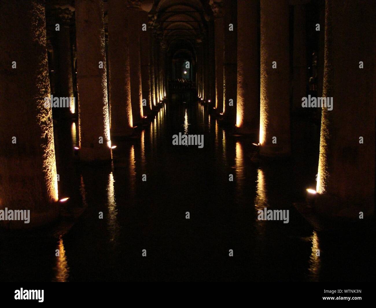 Pathway Along Illuminated Architectural Columns Stock Photo - Alamy