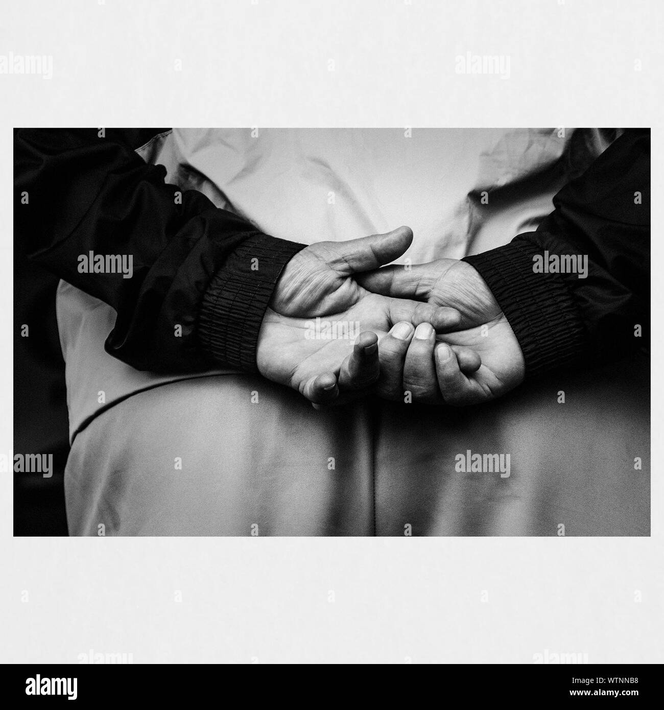 Hands clasped behind back hi-res stock photography and images - Alamy