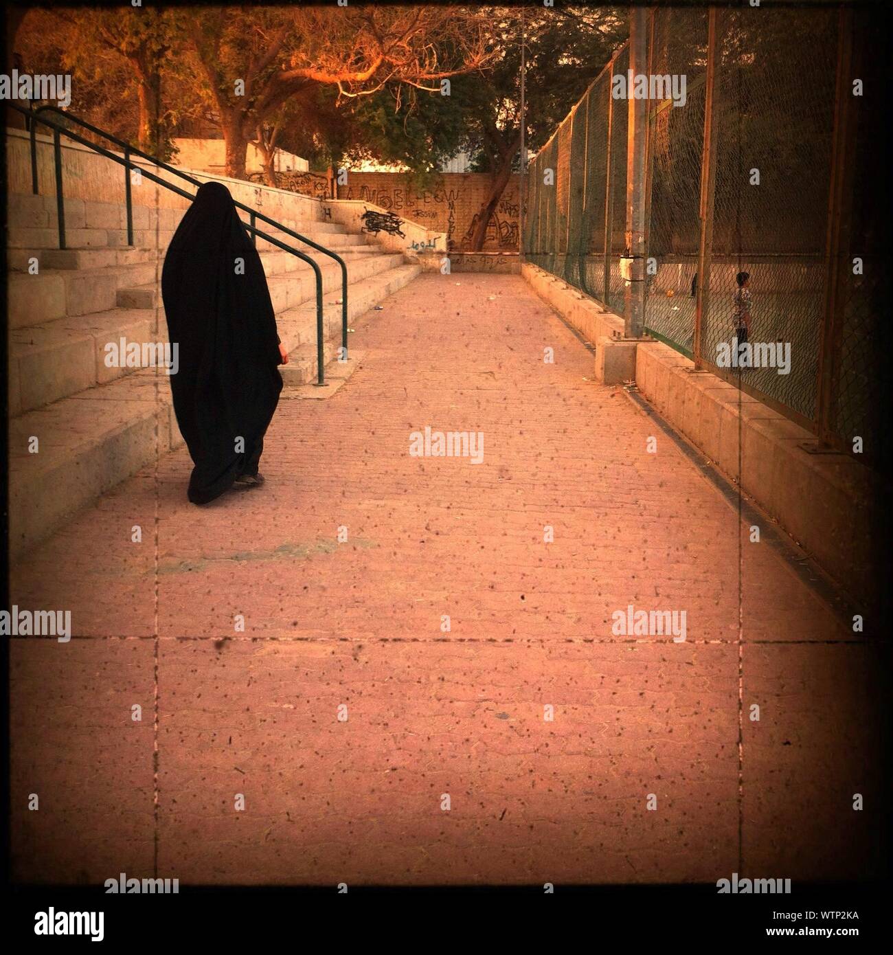 Woman black burka walking hi-res stock photography and images - Alamy
