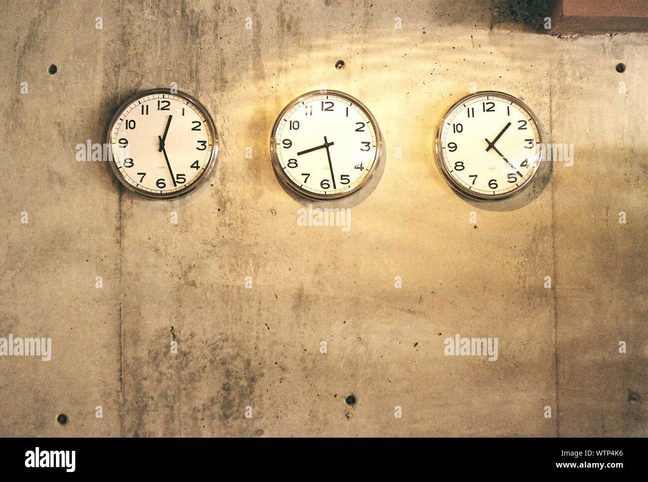 Clocks mounted on wall hi-res stock photography and images - Alamy