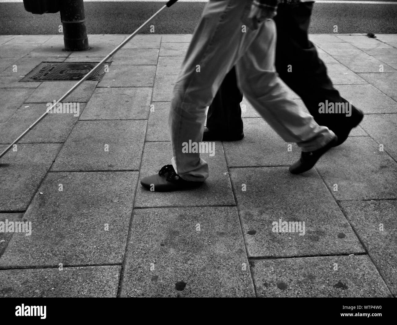 Blind man walking cane hi-res stock photography and images - Alamy
