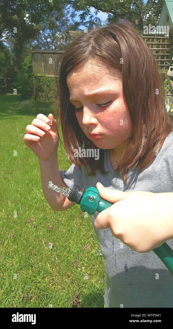 Garden hose lawn hi-res stock photography and images - Alamy