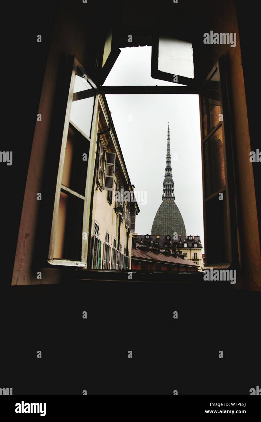 City seen through window frame hi-res stock photography and images - Alamy