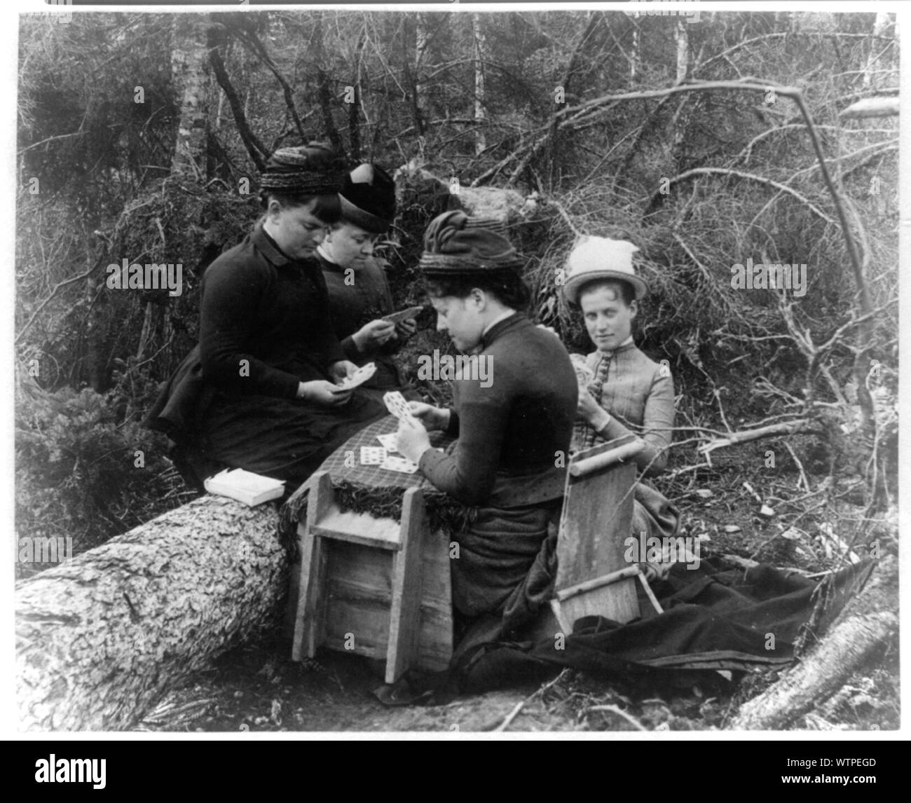Mrs. Cox, Miss Townsend, Mrs. Rowland, Mrs. Phills (?) playing cards at ...