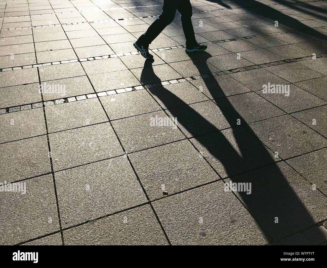 Shadow of walking hi-res stock photography and images - Alamy