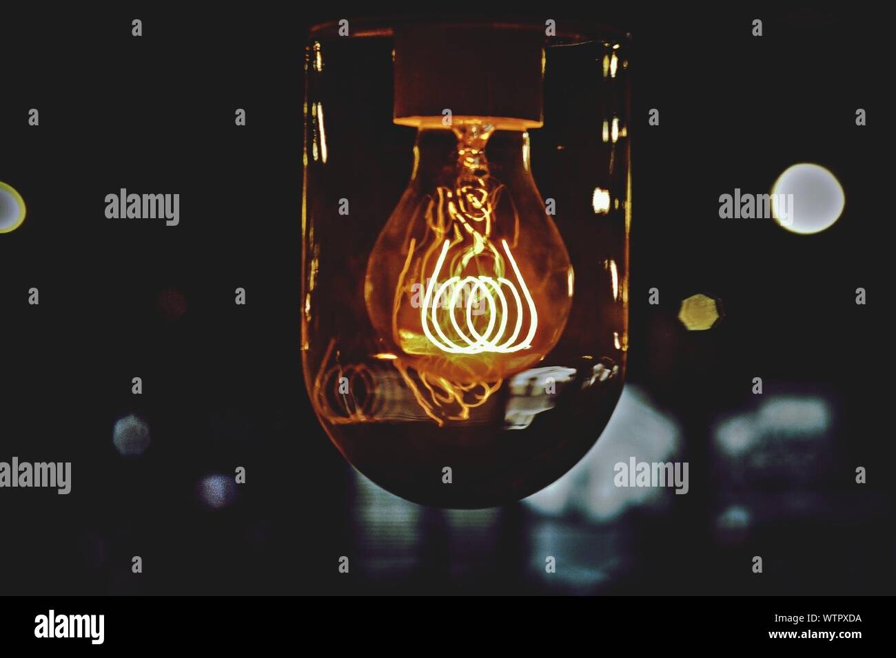 Light bulb filament close up lit up hi-res stock photography and images ...
