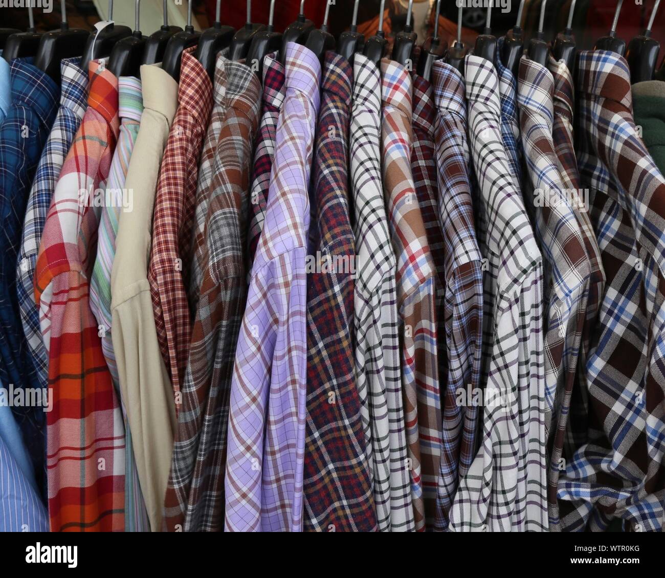 Hanging shirts on rack hi-res stock photography and images - Alamy