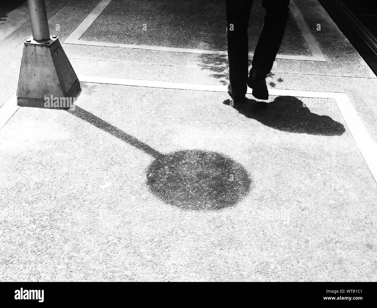 Shadow Of Street Light And Man On Street Stock Photo - Alamy