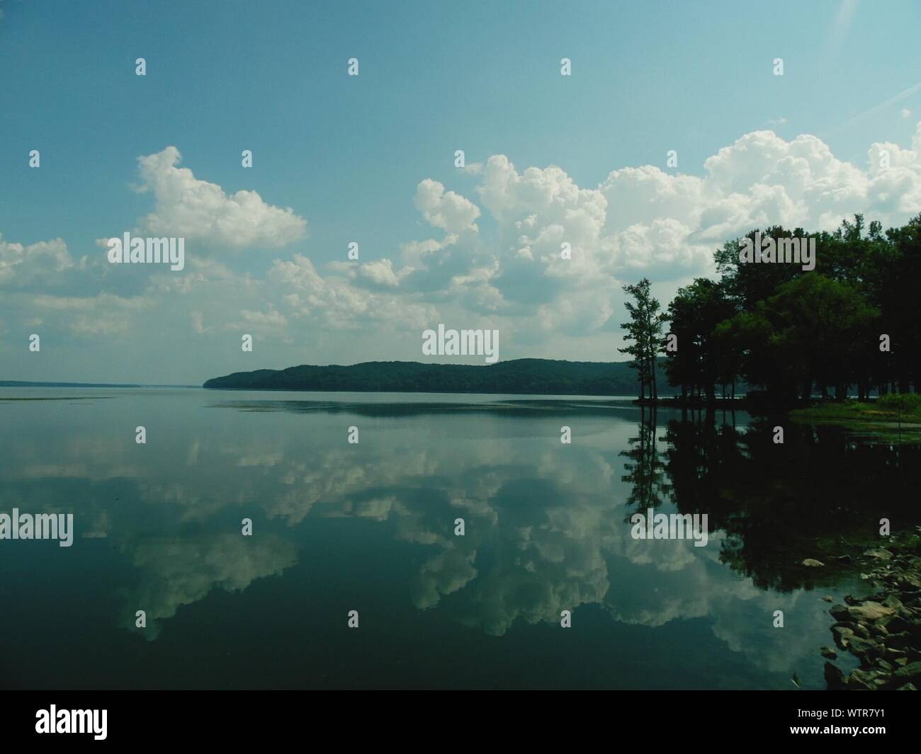 Reflections Of Clouds In Clam Lake Stock Photo - Alamy