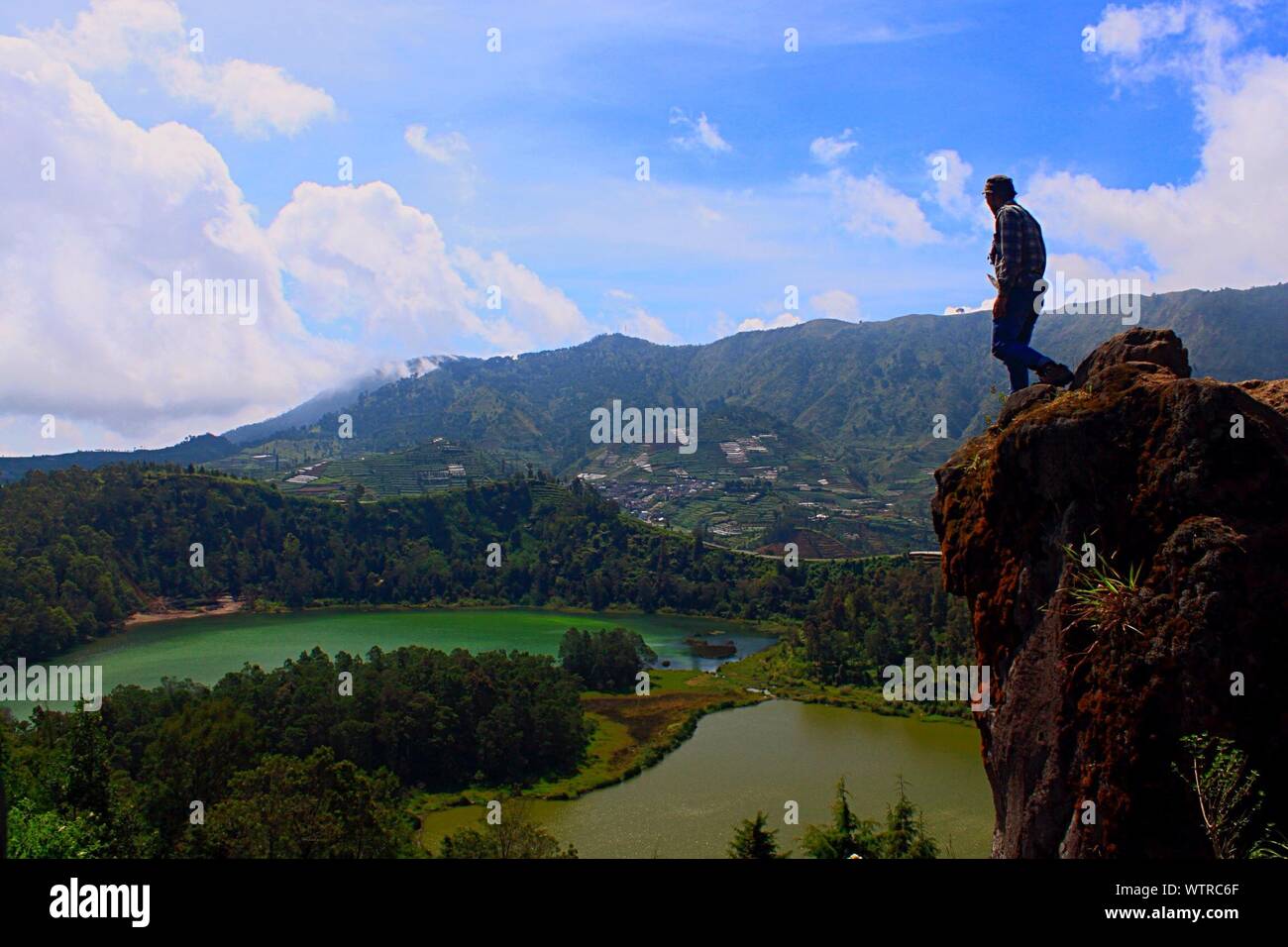Man Standing In Front Cliff High Resolution Stock Photography and ...