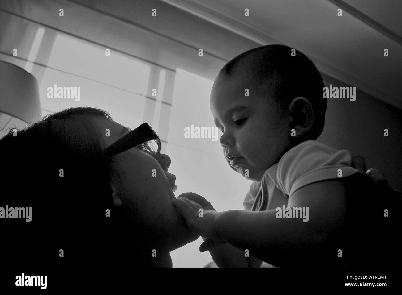 Lifting baby hi-res stock photography and images - Alamy