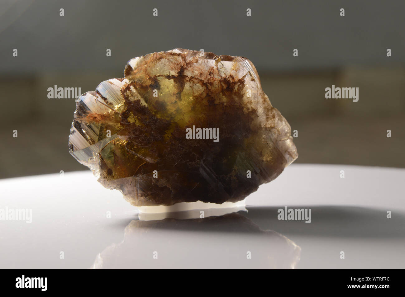 Axinite is famous fir its pleochrois color effects, a close-up on a ...