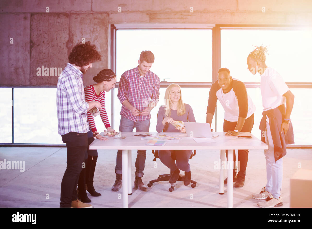 female menager giving money bonus for a well done job to her happy ...