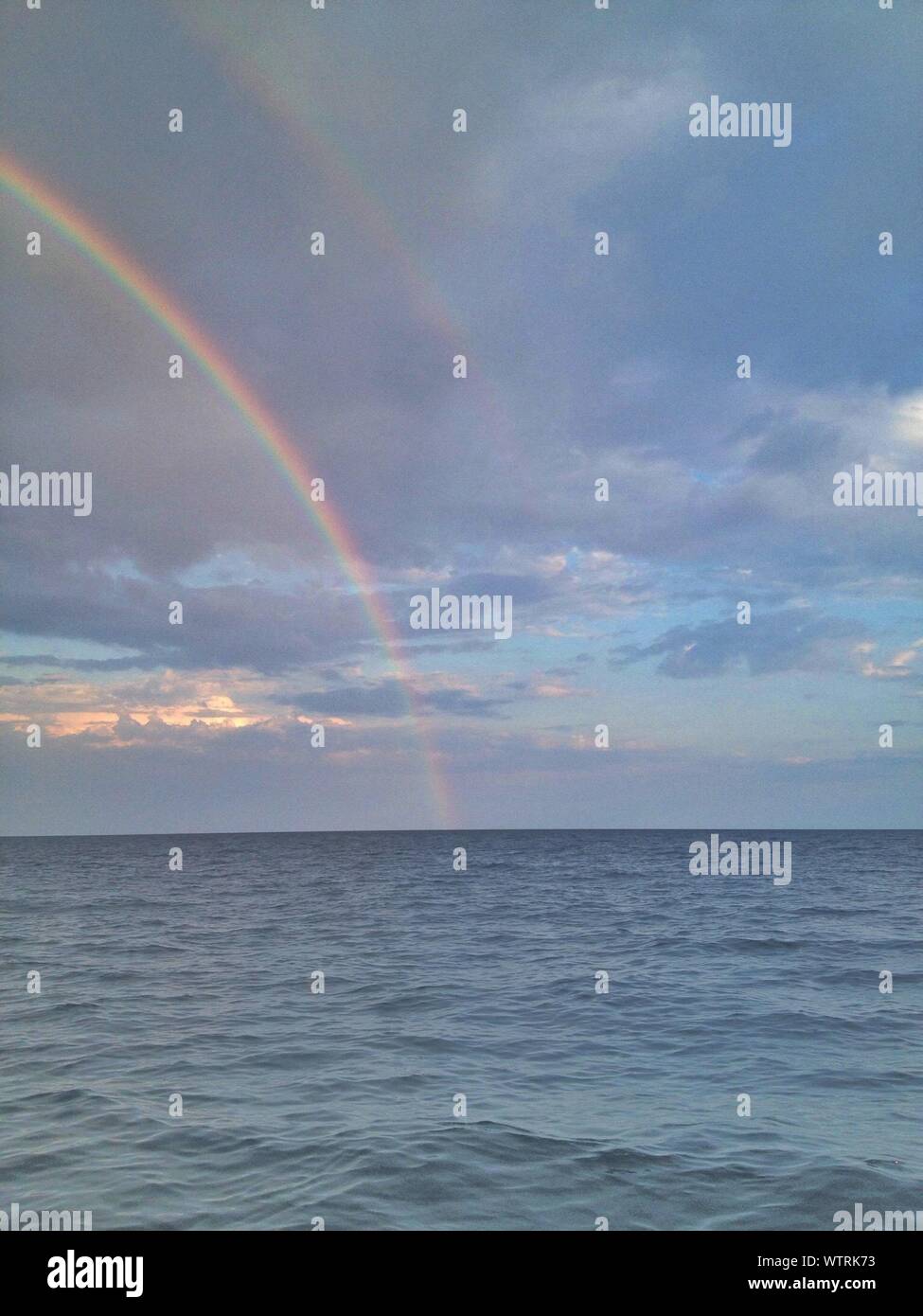 Rainbow above water hi-res stock photography and images - Alamy